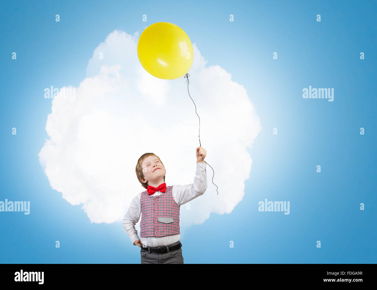 Little boy wearing red bowtie holding colorful balloon Stock Photo - Alamy