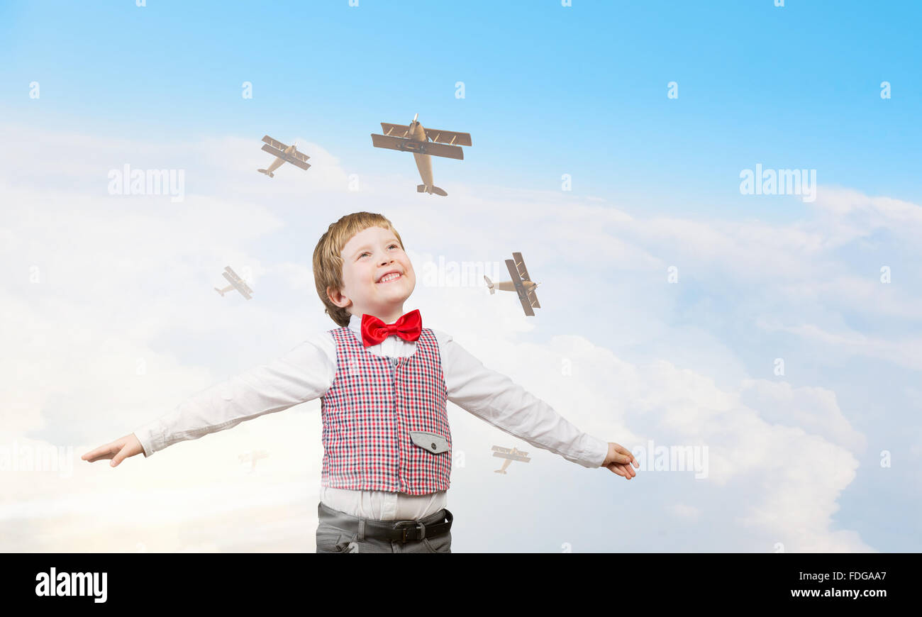 Happy kid boy with hands spread imagine he is flying Stock Photo - Alamy