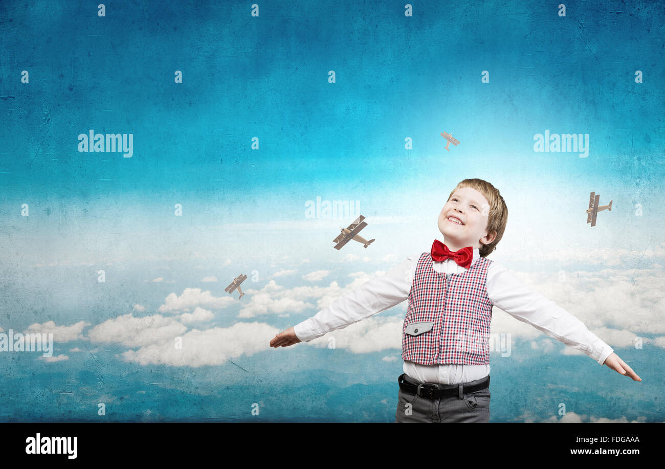 Happy kid boy with hands spread imagine he is flying Stock Photo - Alamy