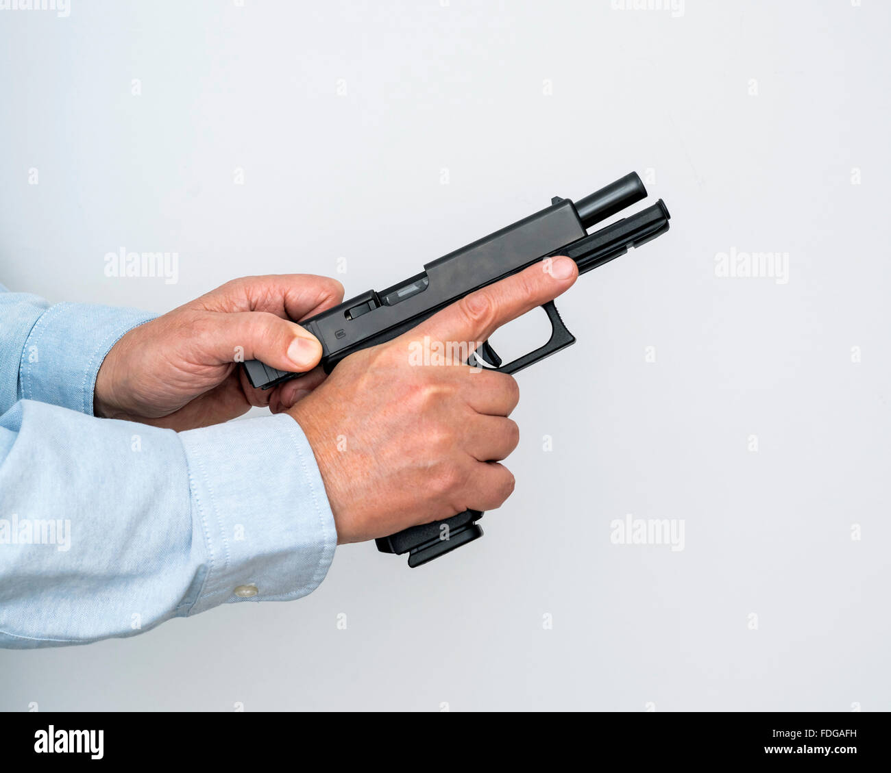 Man reloads the gun Stock Photo - Alamy