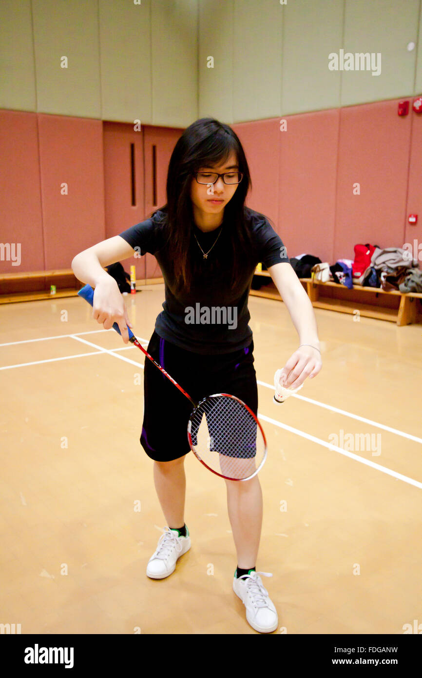 Asian woman playing badminton Stock Photo - Alamy