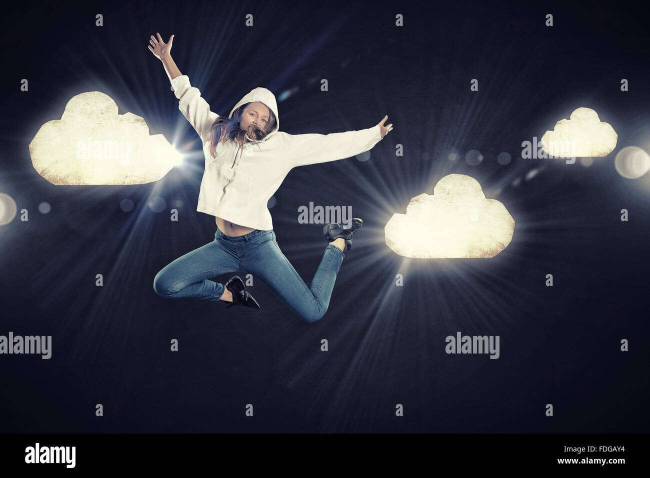 Young woman dancer jumping in spotlights on dark background Stock Photo ...