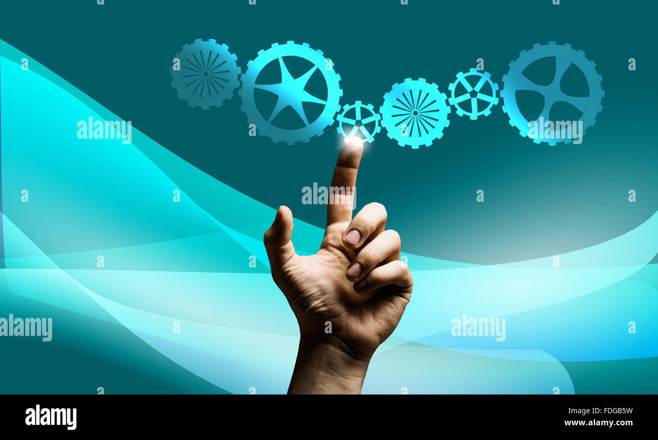 Close up human hand pointing with finger at gears mechanism Stock Photo ...