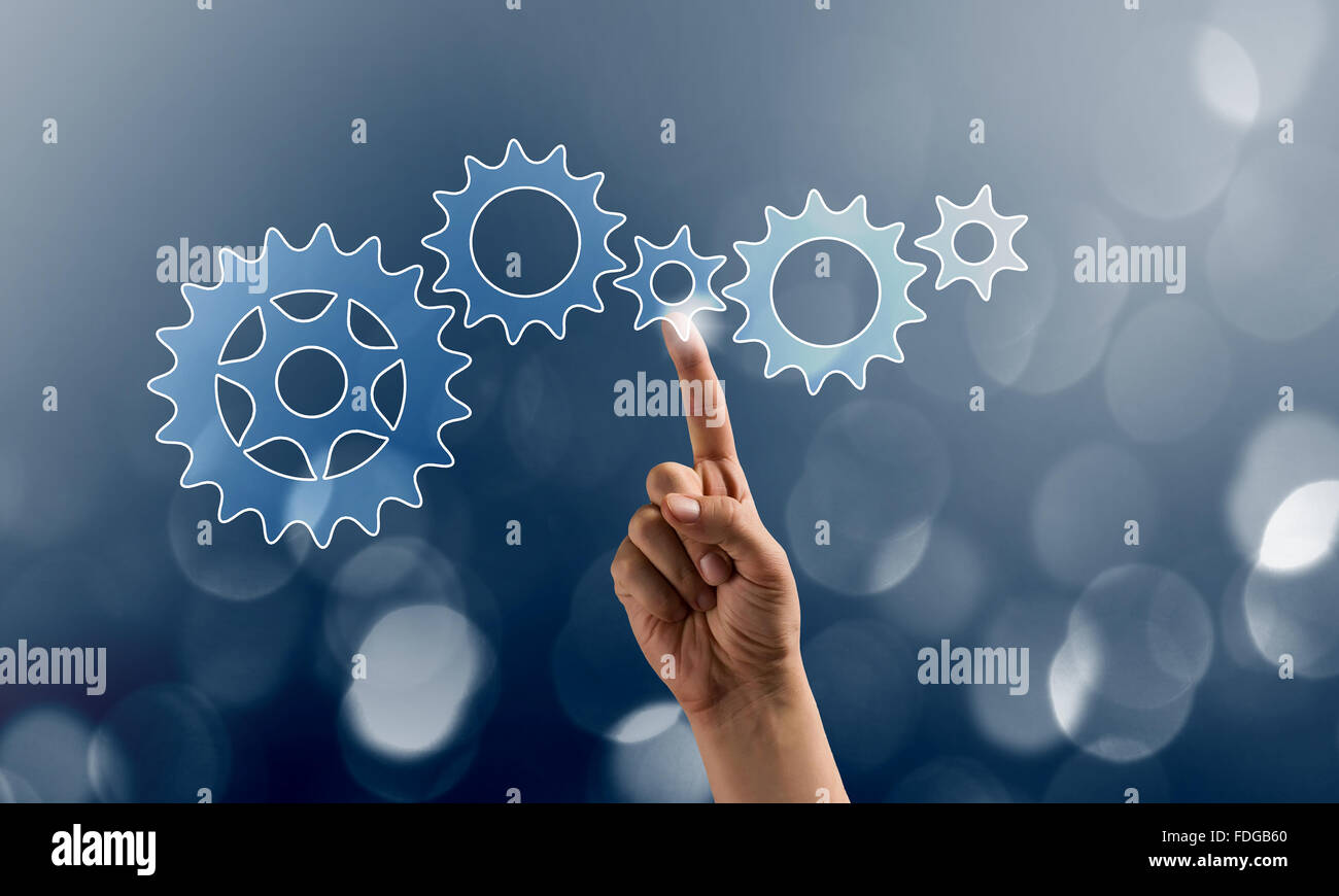 Close up human hand pointing with finger at gears mechanism Stock Photo ...