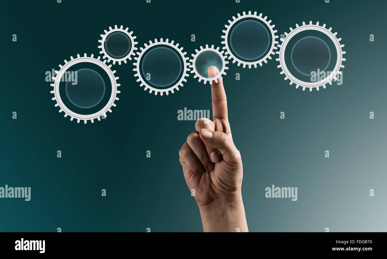 Close up human hand pointing with finger at gears mechanism Stock Photo ...