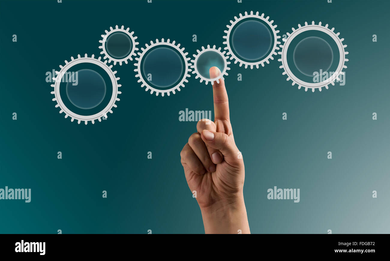 Close up human hand pointing with finger at gears mechanism Stock Photo ...