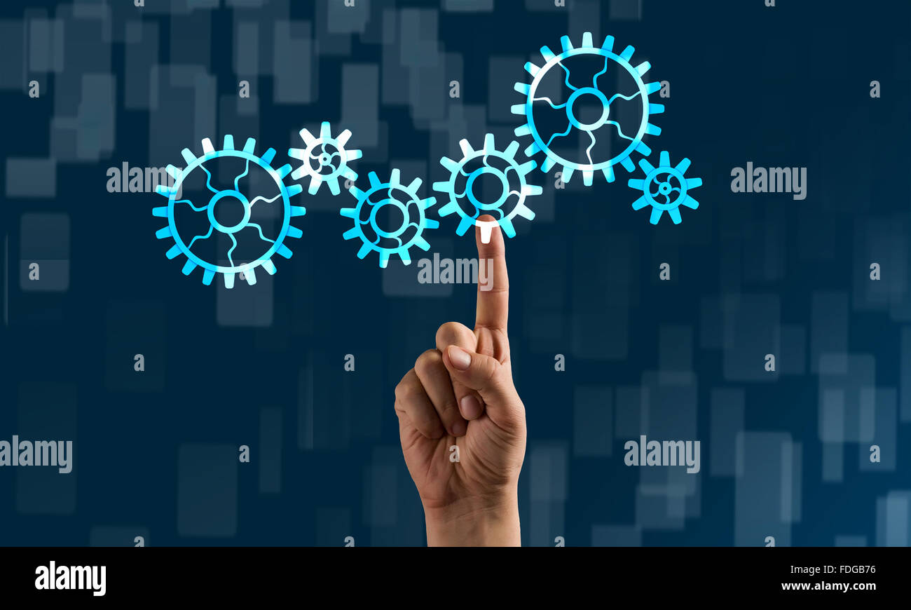 Close up human hand pointing with finger at gears mechanism Stock Photo ...