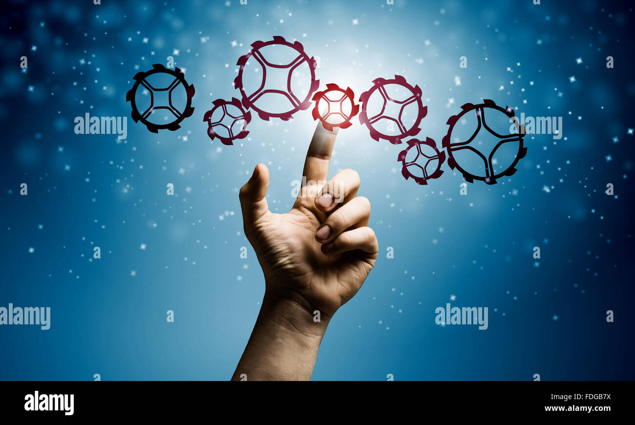 Close up human hand pointing with finger at gears mechanism Stock Photo ...