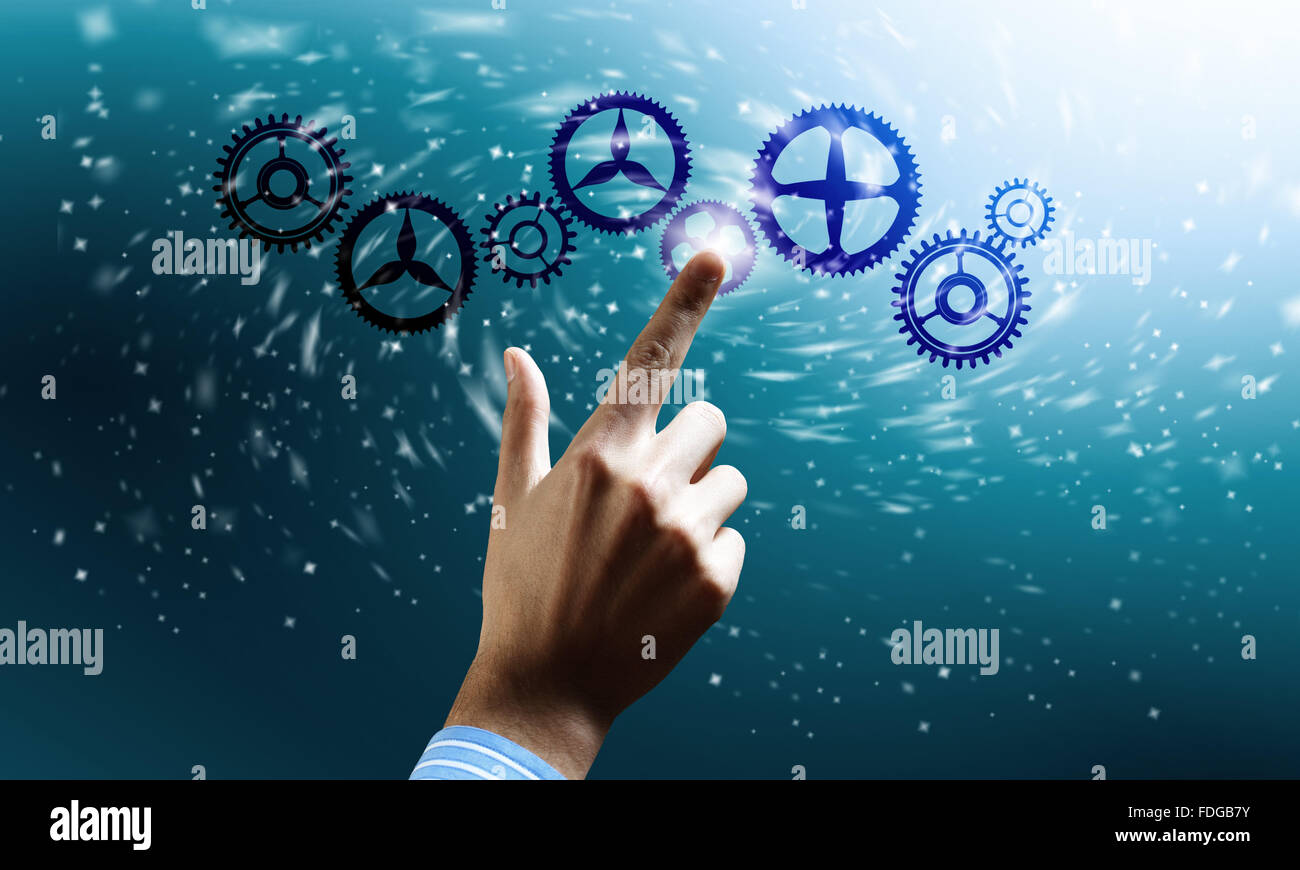 Close up human hand pointing with finger at gears mechanism Stock Photo ...