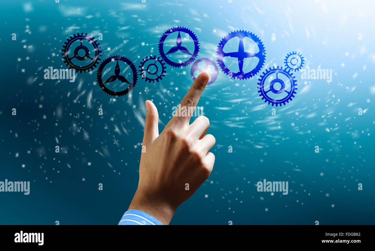 Close up human hand pointing with finger at gears mechanism Stock Photo ...