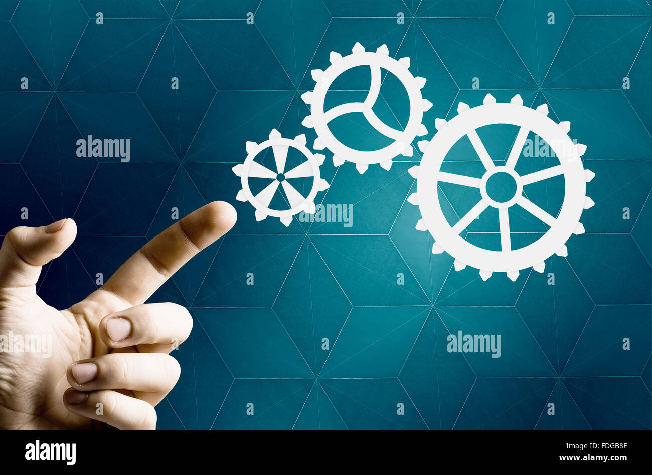 Close up human hand pointing with finger at gears mechanism Stock Photo ...