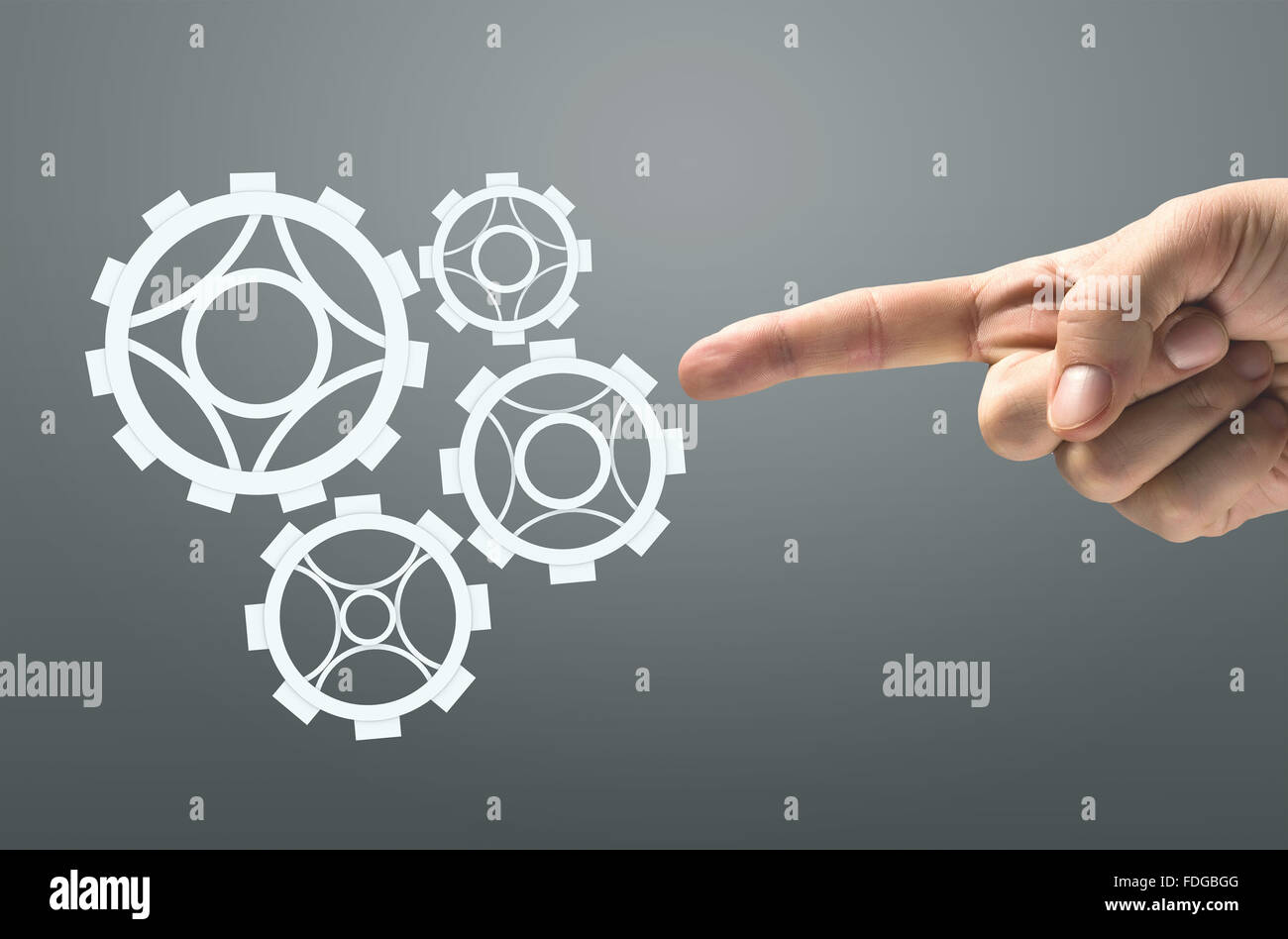 Close up human hand pointing with finger at gears mechanism Stock Photo ...