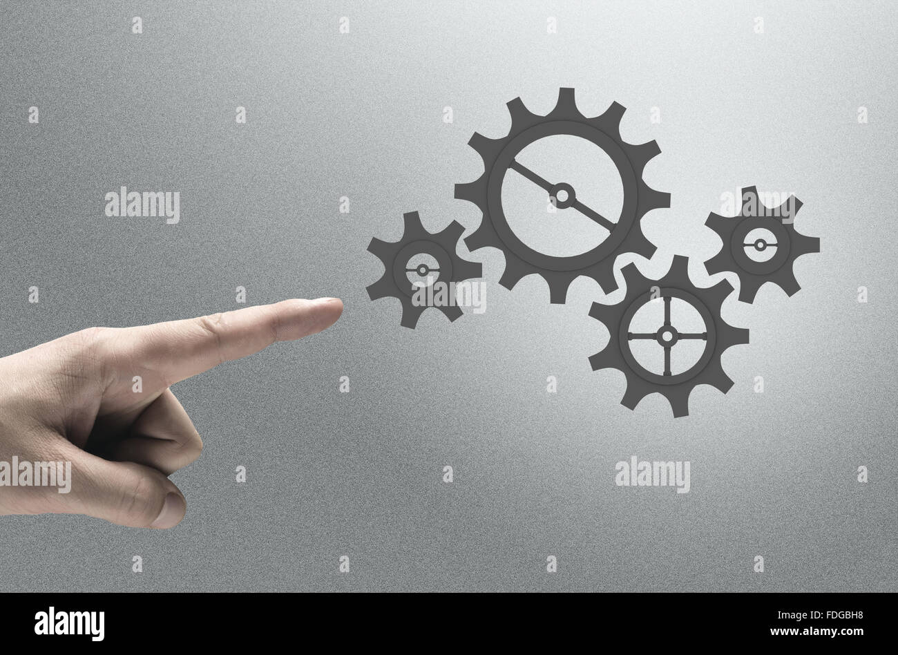 Close up human hand pointing with finger at gears mechanism Stock Photo ...