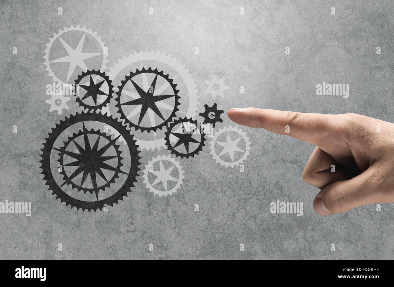 Close up human hand pointing with finger at gears mechanism Stock Photo ...