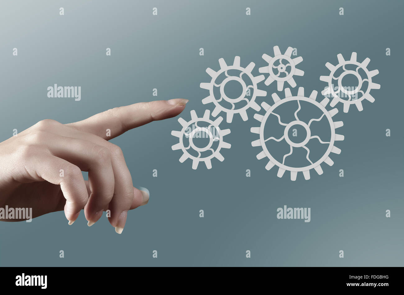 Close up human hand pointing with finger at gears mechanism Stock Photo ...