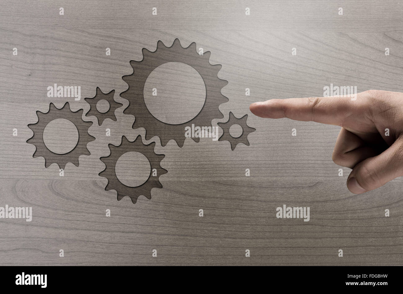 Close up human hand pointing with finger at gears mechanism Stock Photo ...