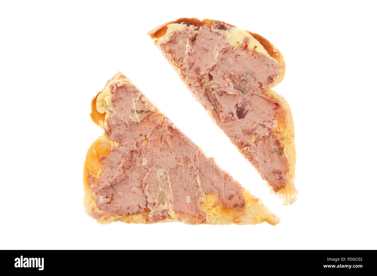Farmhouse pate on a slice of buttered toast cut in half isolated ...