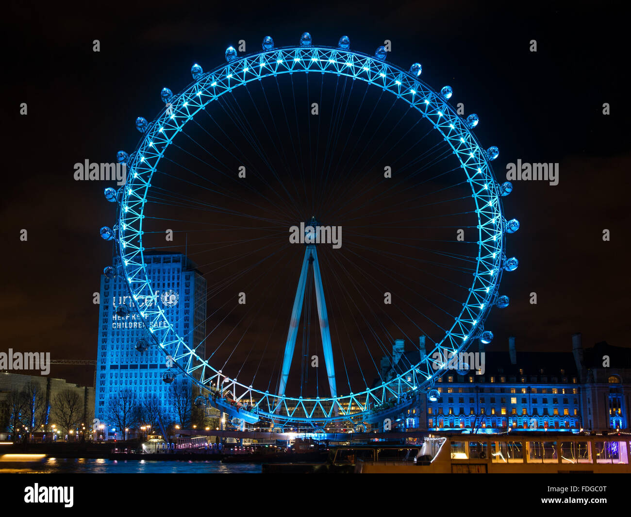The London Eye lit up in Unicef's cyan blue. This is to encourage ...