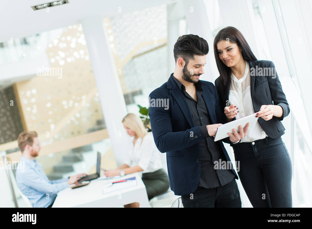 Team young people sitting in hi-res stock photography and images - Alamy