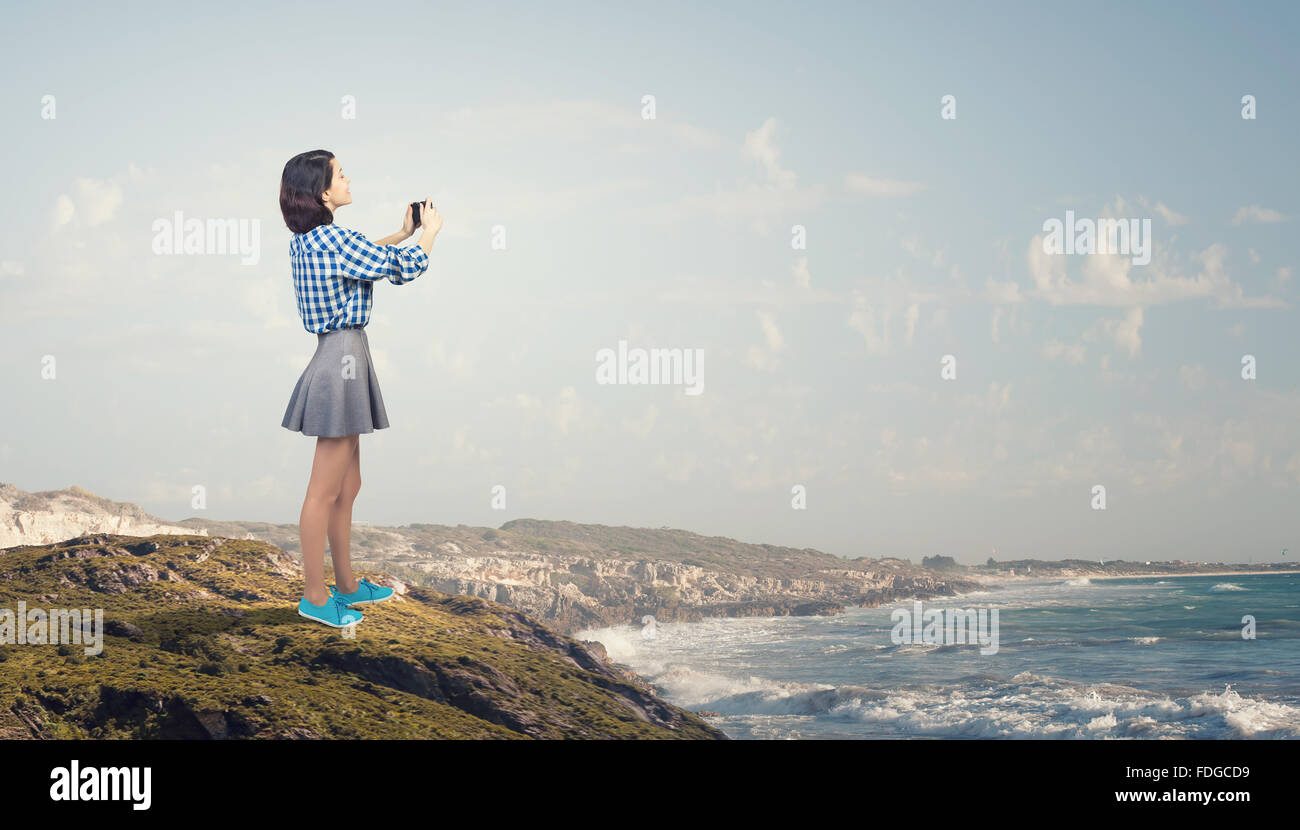 Young beautiful woman taking photo with retro camera Stock Photo - Alamy