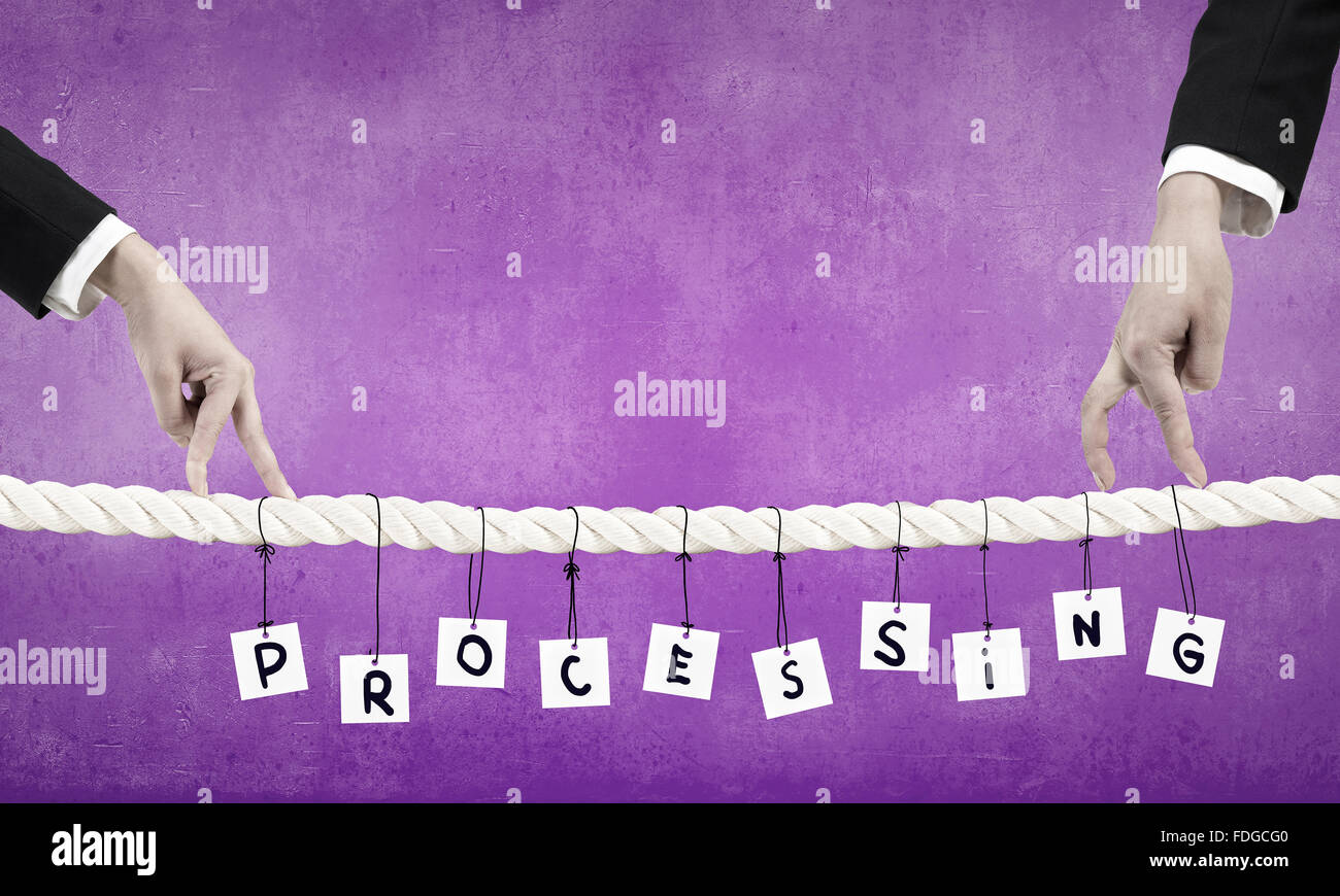 Close up of businessman hands walking with fingers on rope as ...