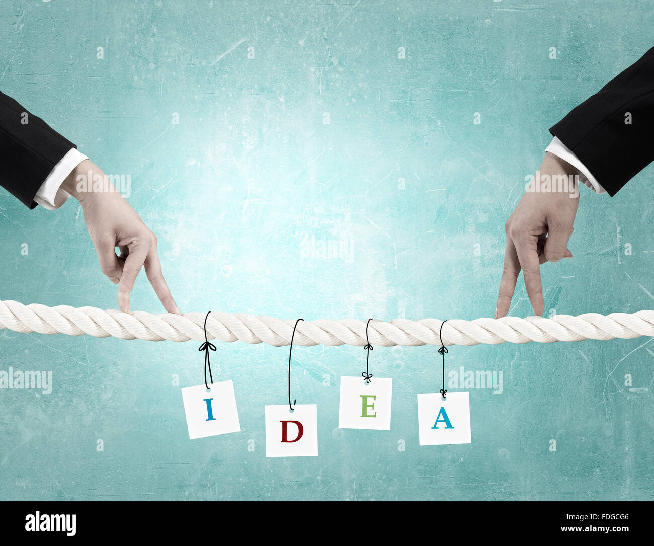 Close up of businessman hands walking with fingers on rope as ...