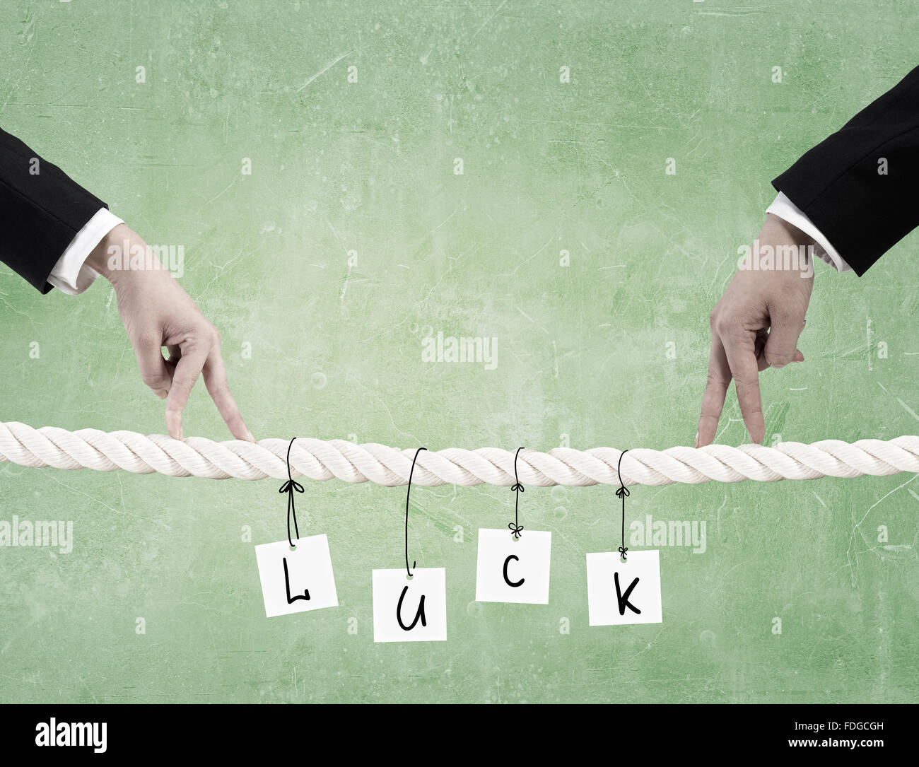 Close up of businessman hands walking with fingers on rope as ...