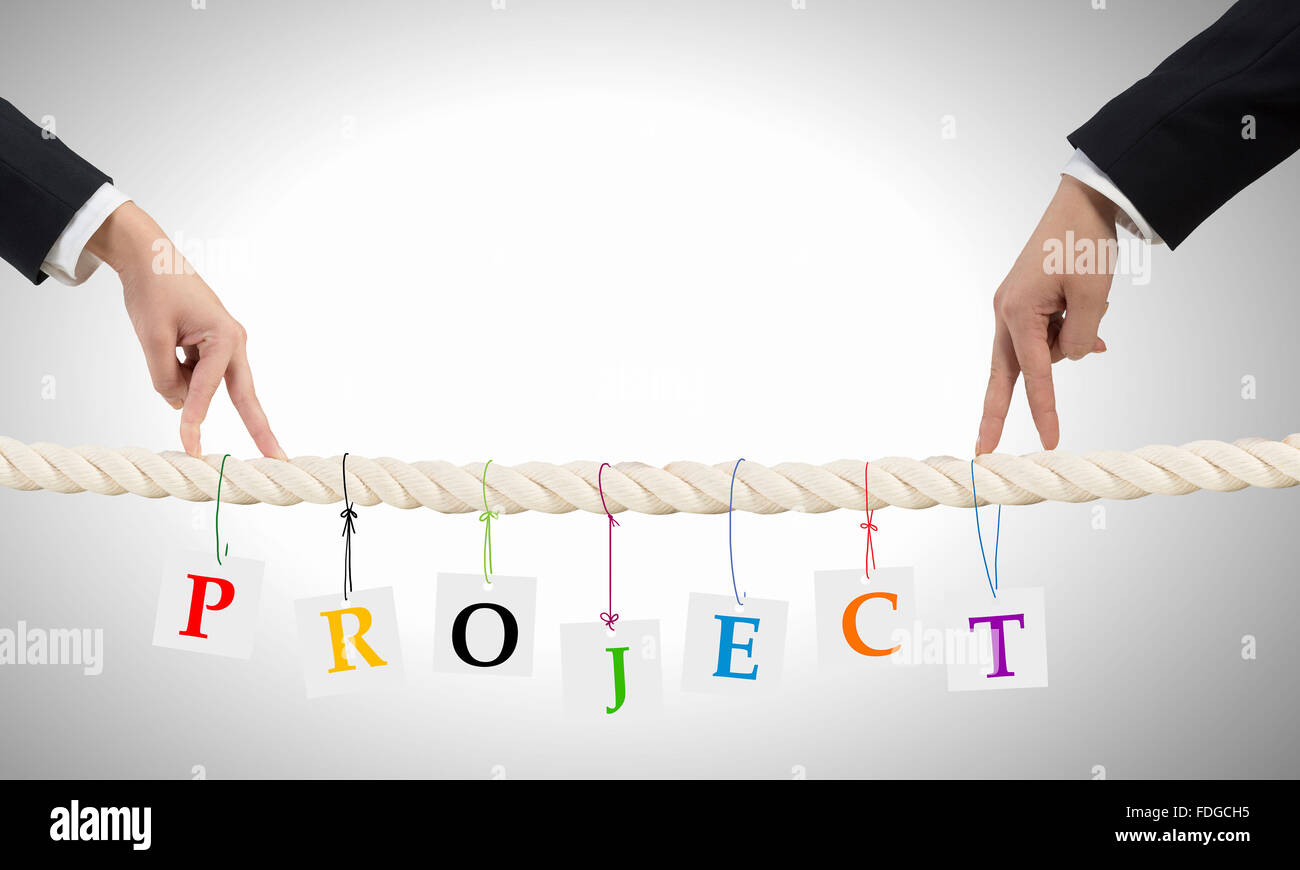 Close up of businessman hands walking with fingers on rope as ...