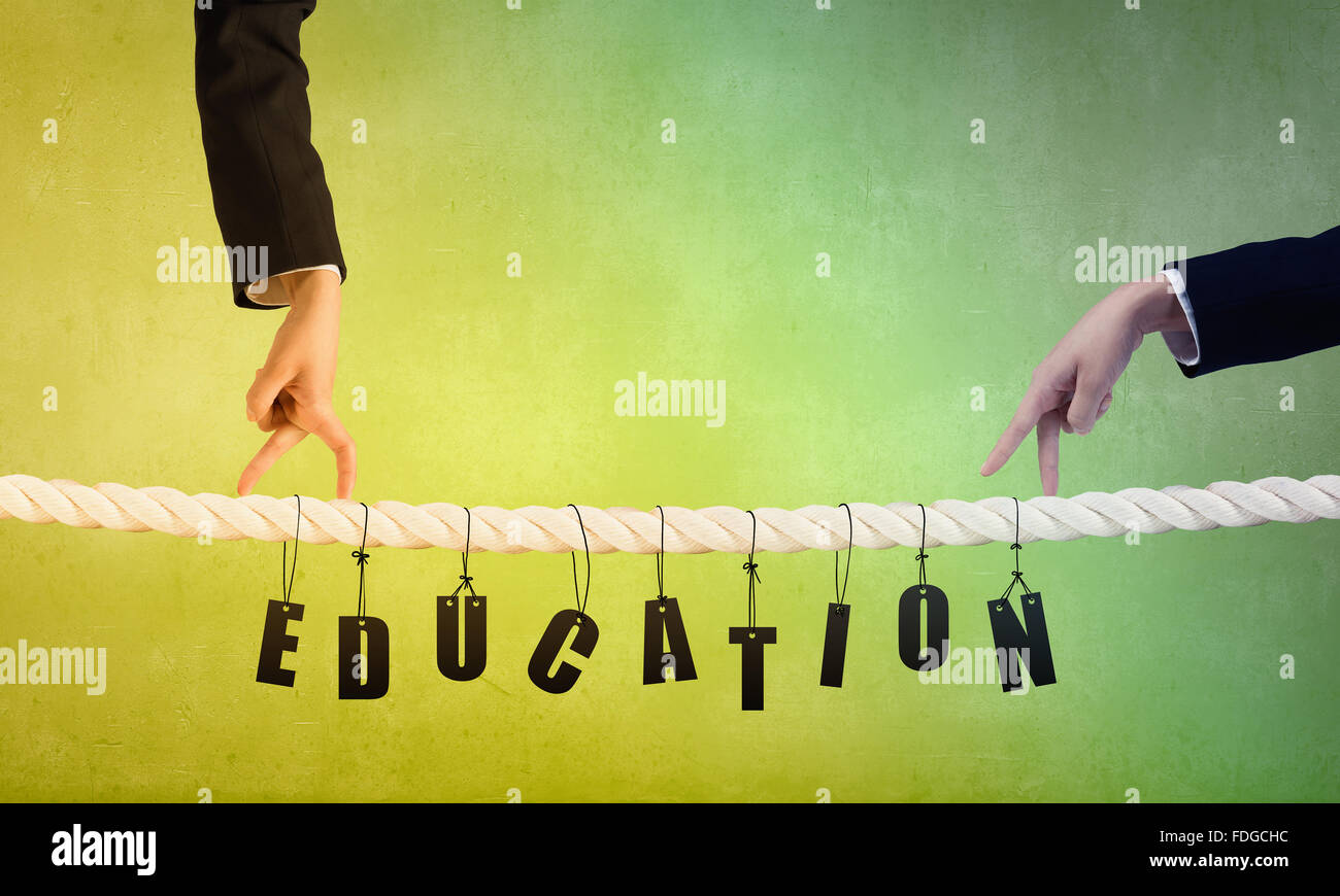 Close up of businessman hands walking with fingers on rope as ...