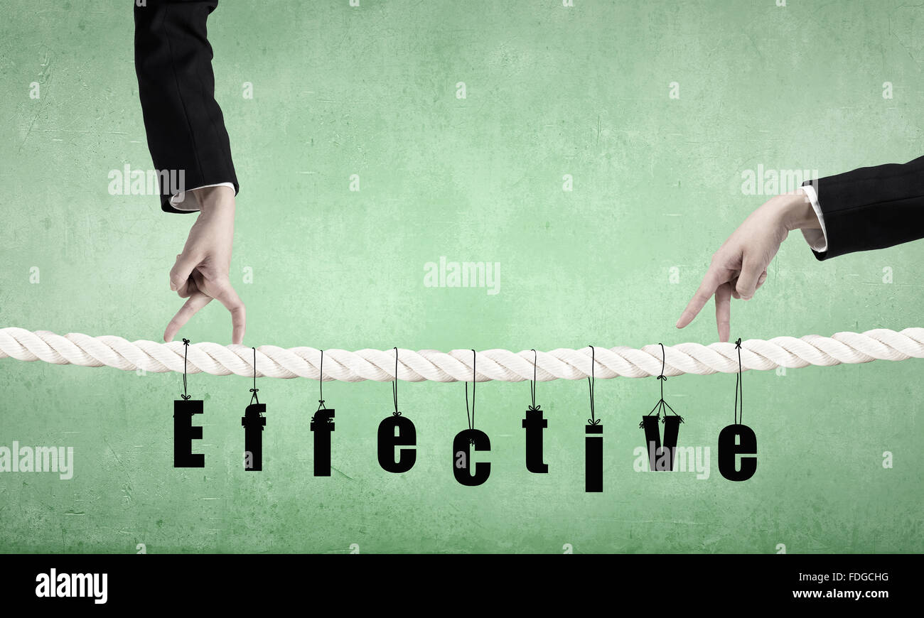 Close up of businessman hands walking with fingers on rope as ...