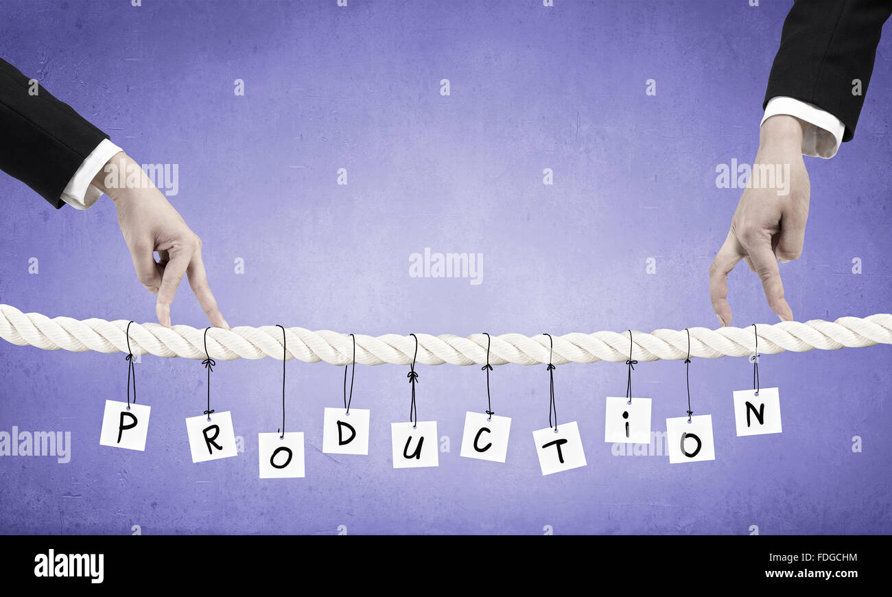 Close up of businessman hands walking with fingers on rope as ...