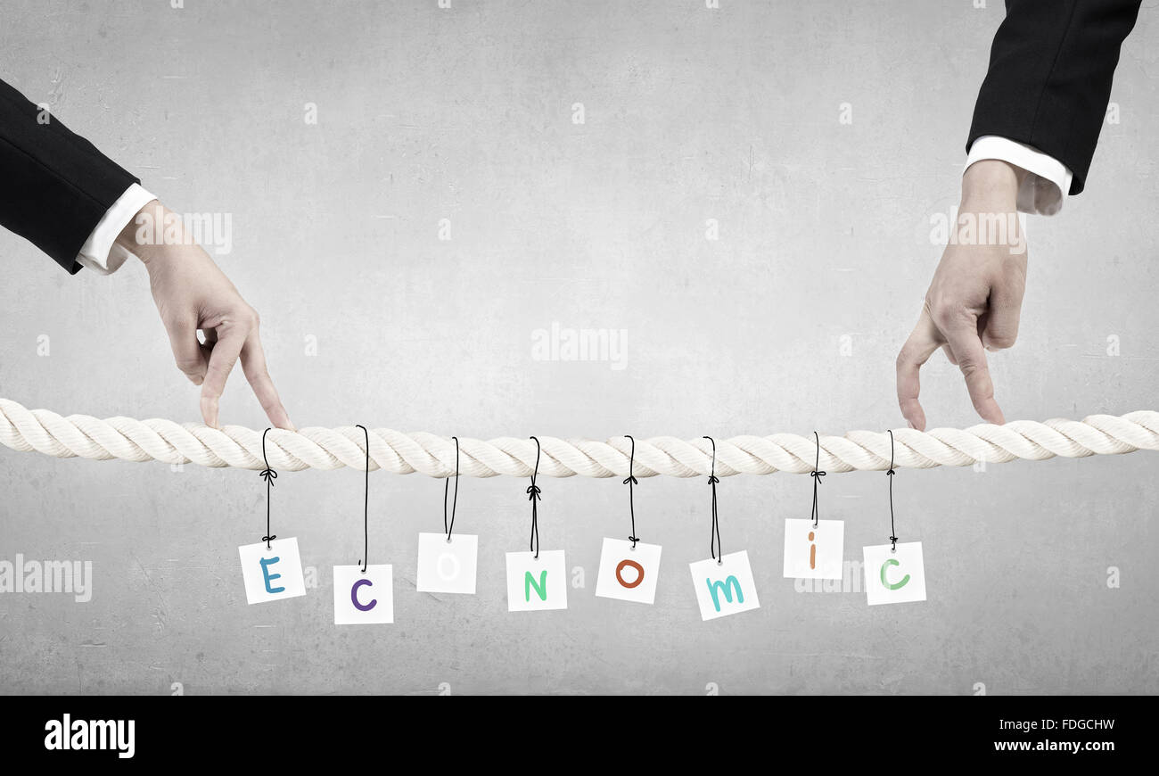 Close up of businessman hands walking with fingers on rope as ...
