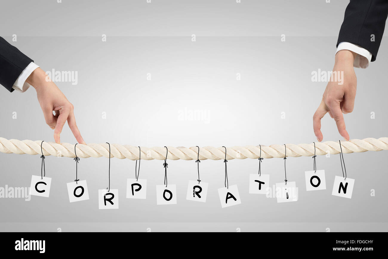 Close up of businessman hands walking with fingers on rope as ...