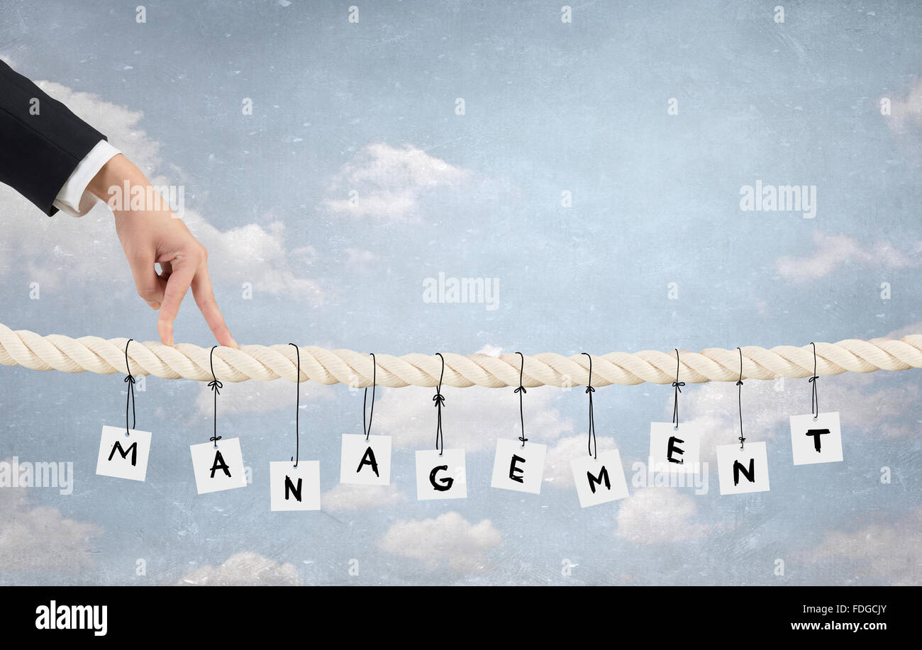 Close up of businessman hands walking with fingers on rope as ...