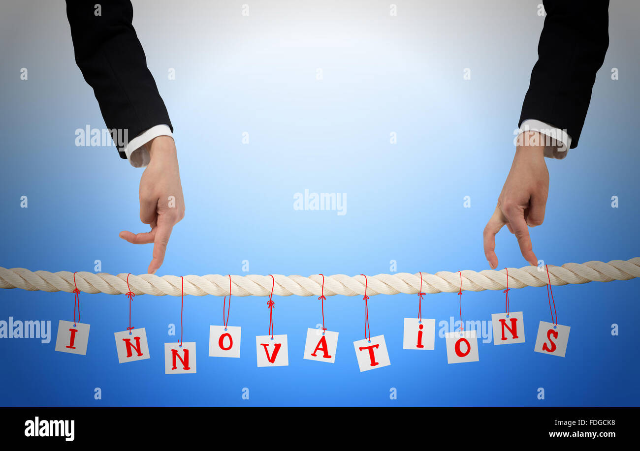 Close up of businessman hands walking with fingers on rope as ...