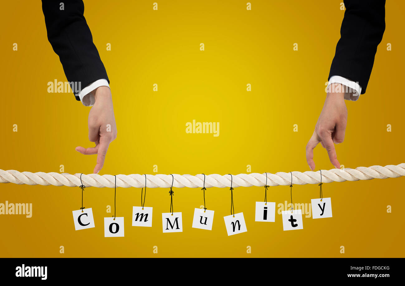 Close up of businessman hands walking with fingers on rope as ...