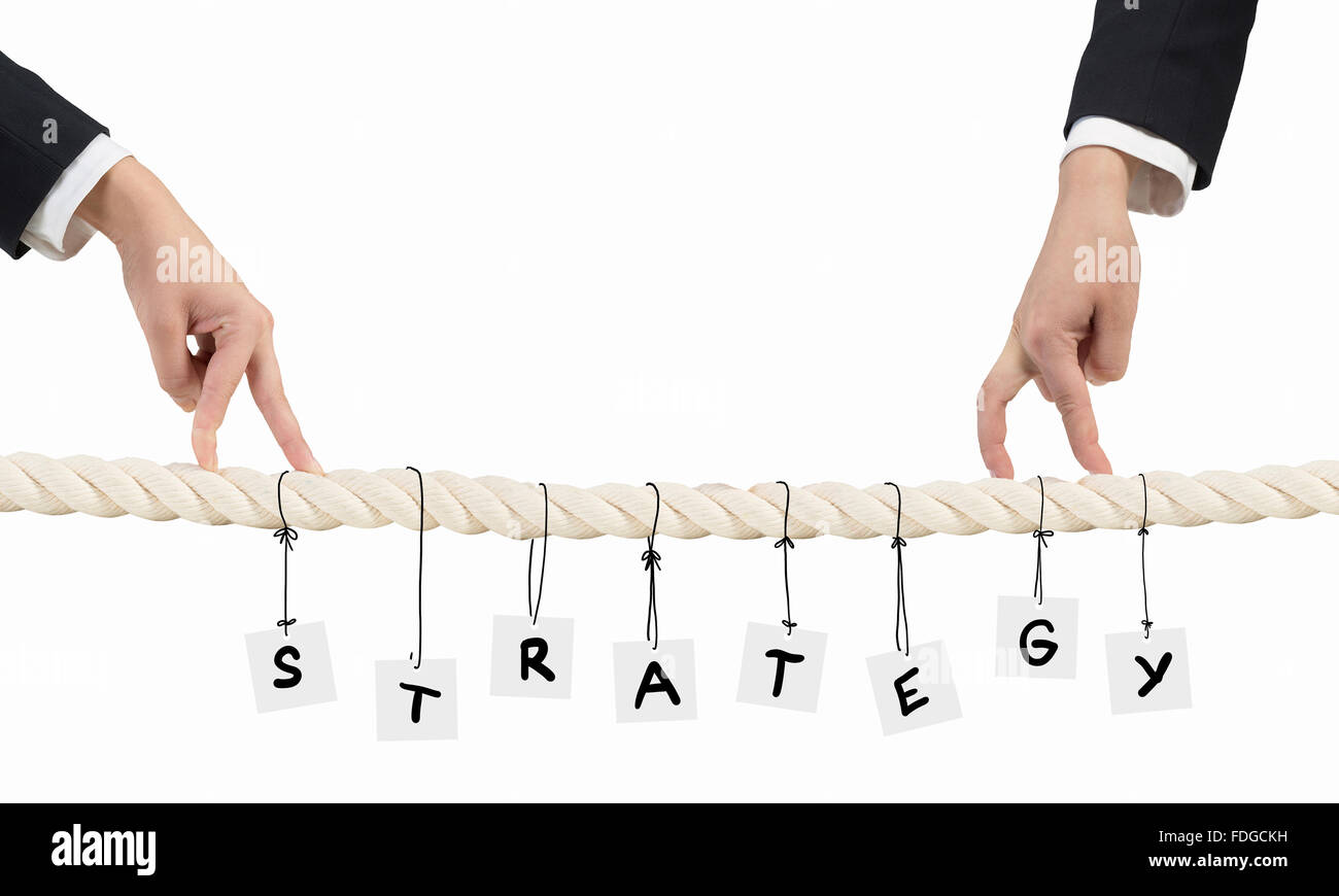 Close up of businessman hands walking with fingers on rope as ...