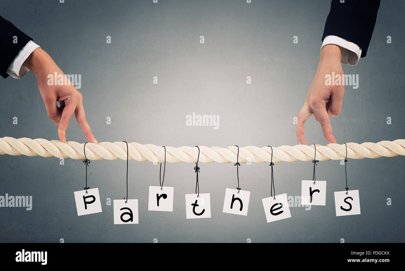 Close up of businessman hands walking with fingers on rope as ...