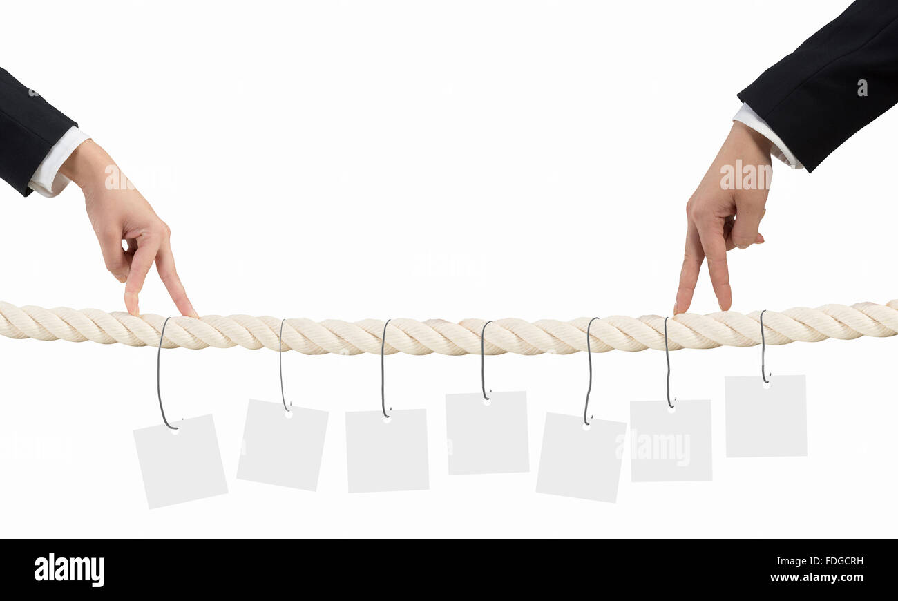 Close up of businessman hands walking with fingers on rope as ...