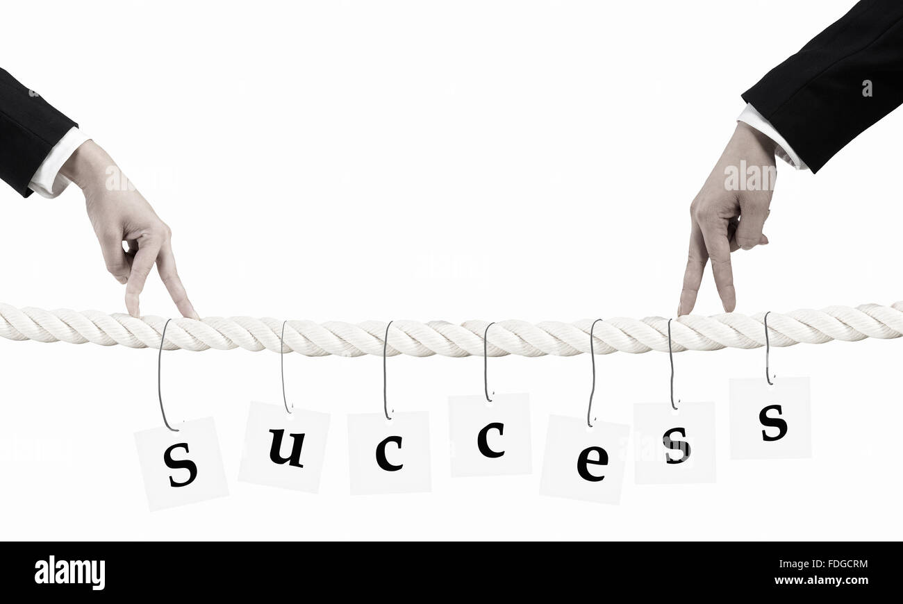 Close up of businessman hands walking with fingers on rope as ...