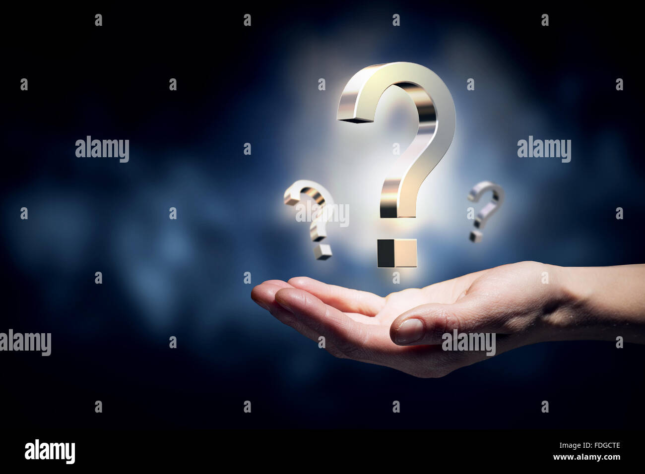 Hand holding question mark in palms on dark background Stock Photo - Alamy