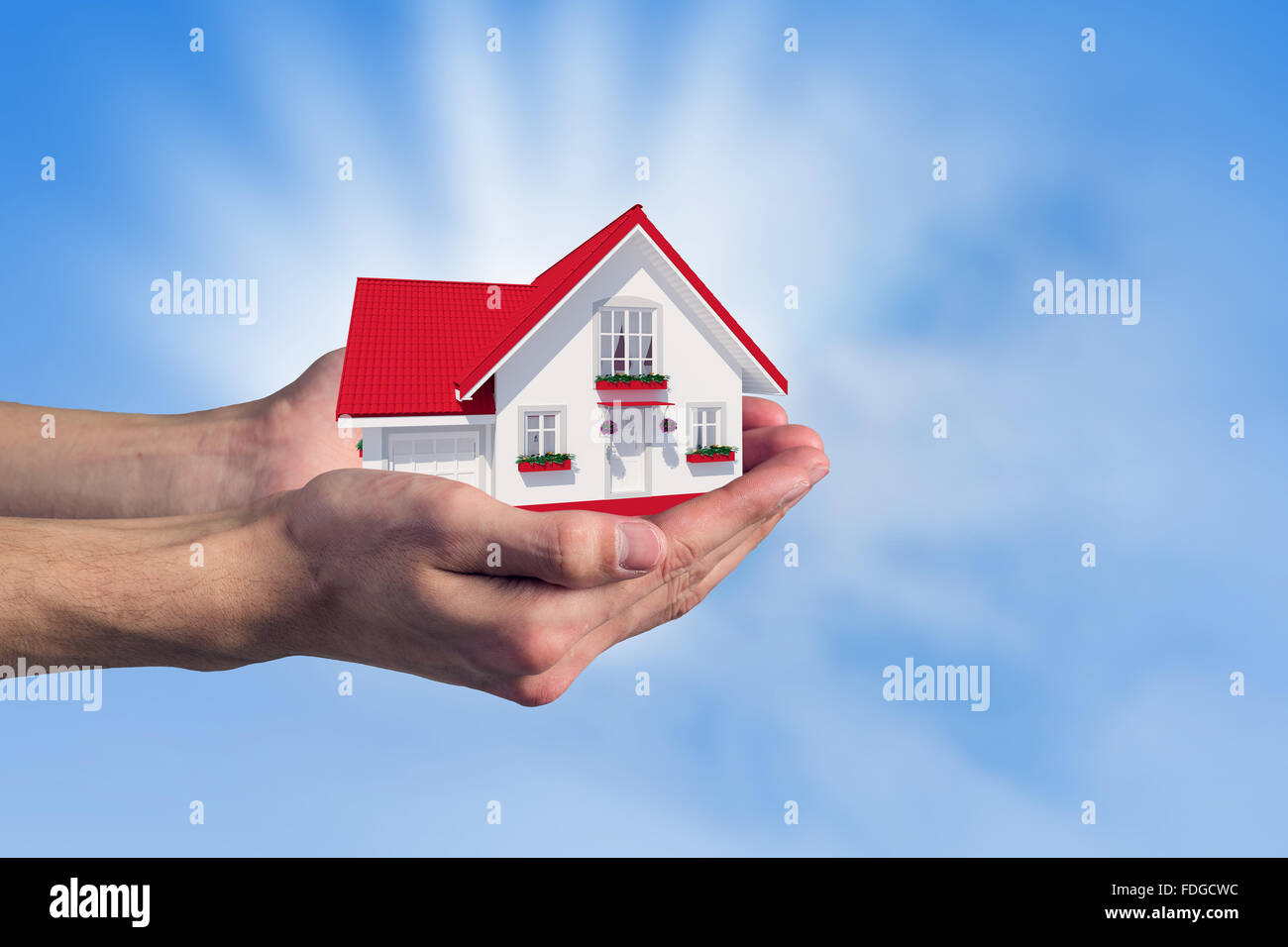 Human hands holding model of dream house Stock Photo - Alamy