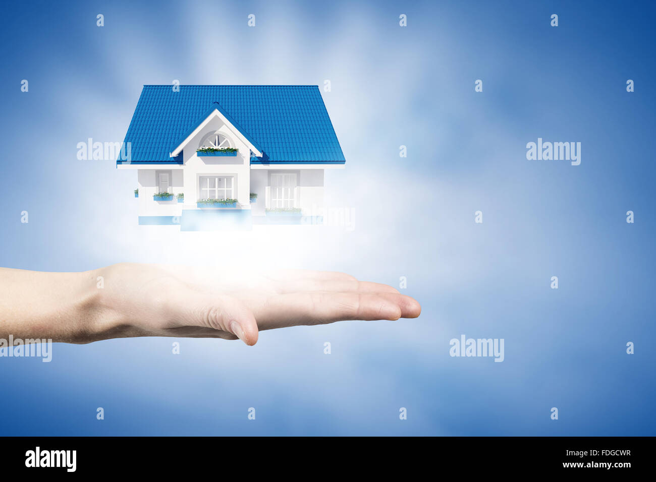 Human hands holding model of dream house Stock Photo - Alamy