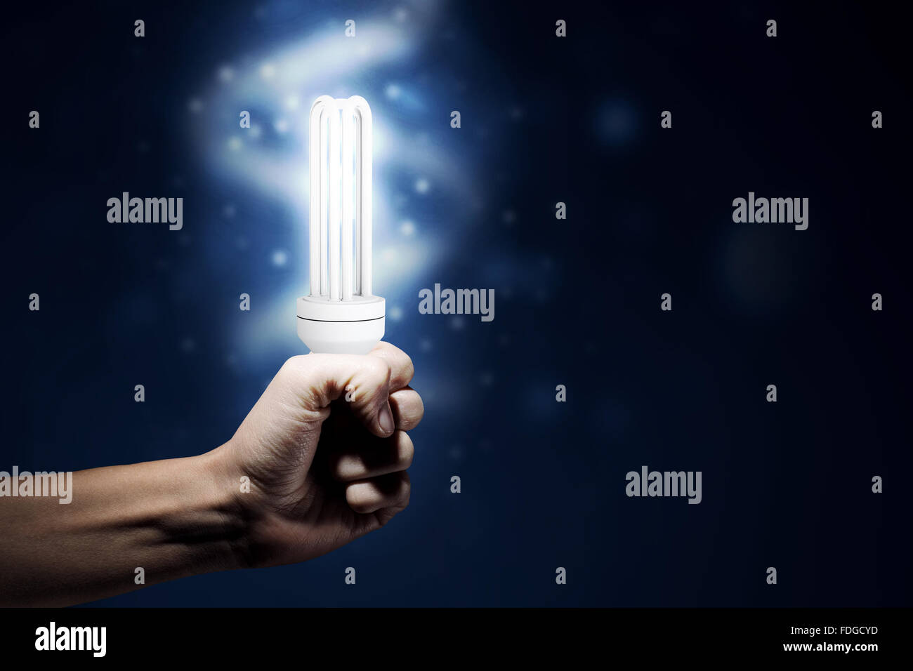 Close up of hand holding glowing light bulb Stock Photo - Alamy