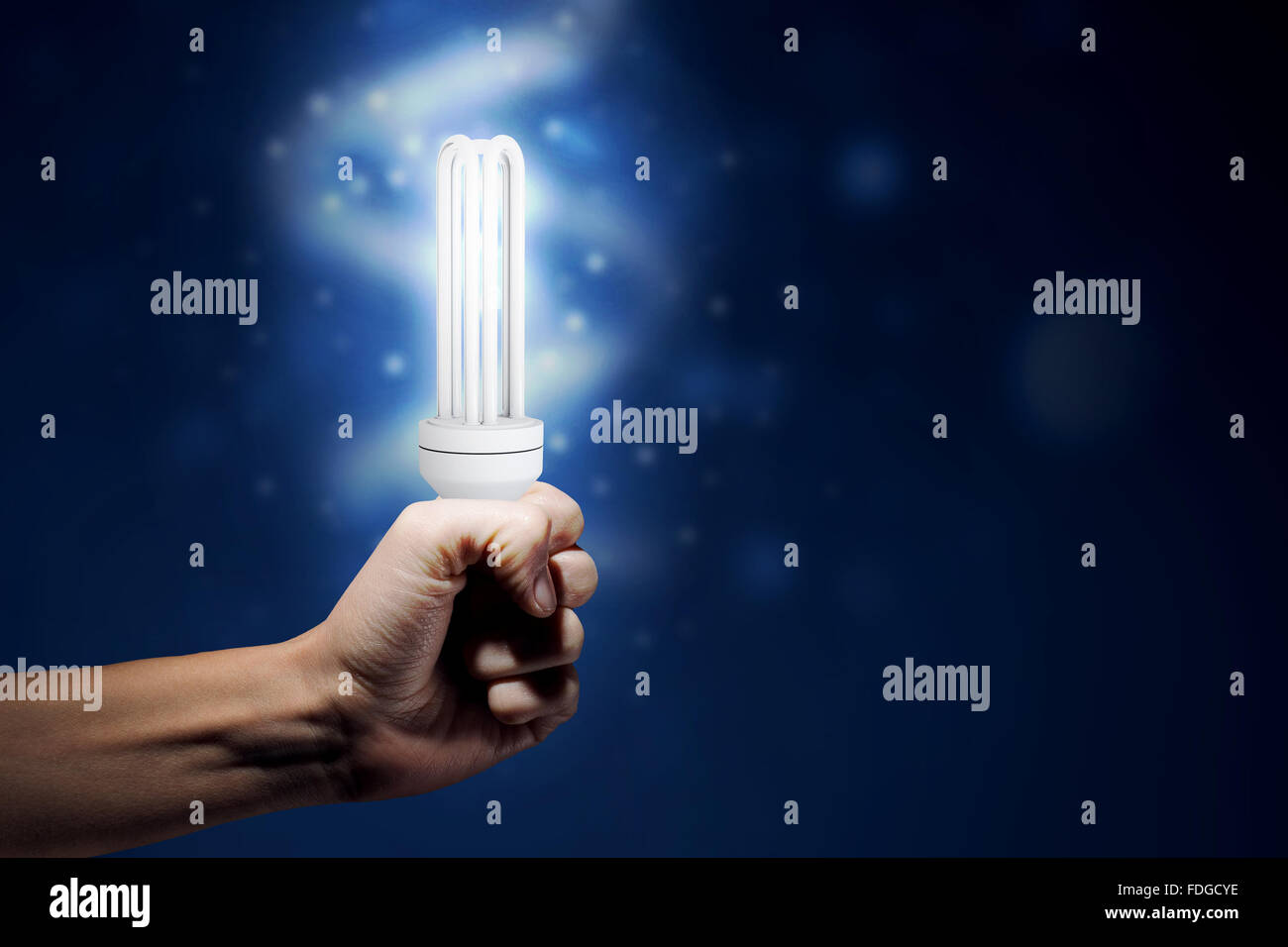 Close up of hand holding glowing light bulb Stock Photo - Alamy