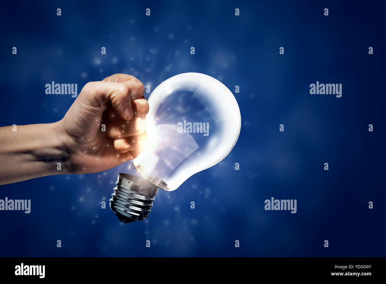Human hand hitting glass light bulb with fist Stock Photo - Alamy