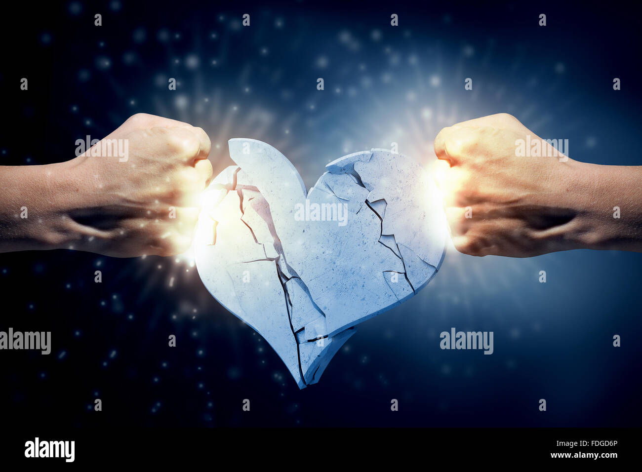 Close up of human hand breaking stone heart Stock Photo - Alamy