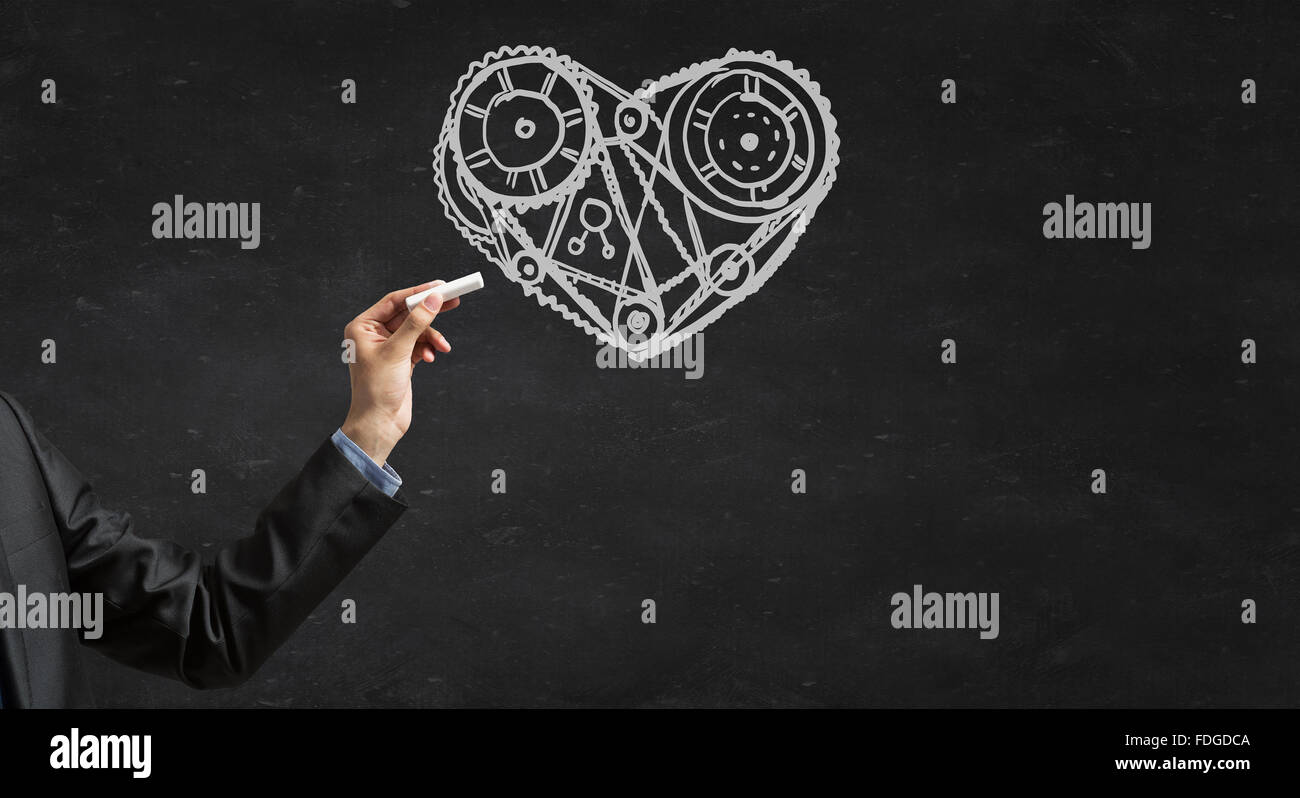 Close up of hand drawing gears mechanism with chalk Stock Photo - Alamy