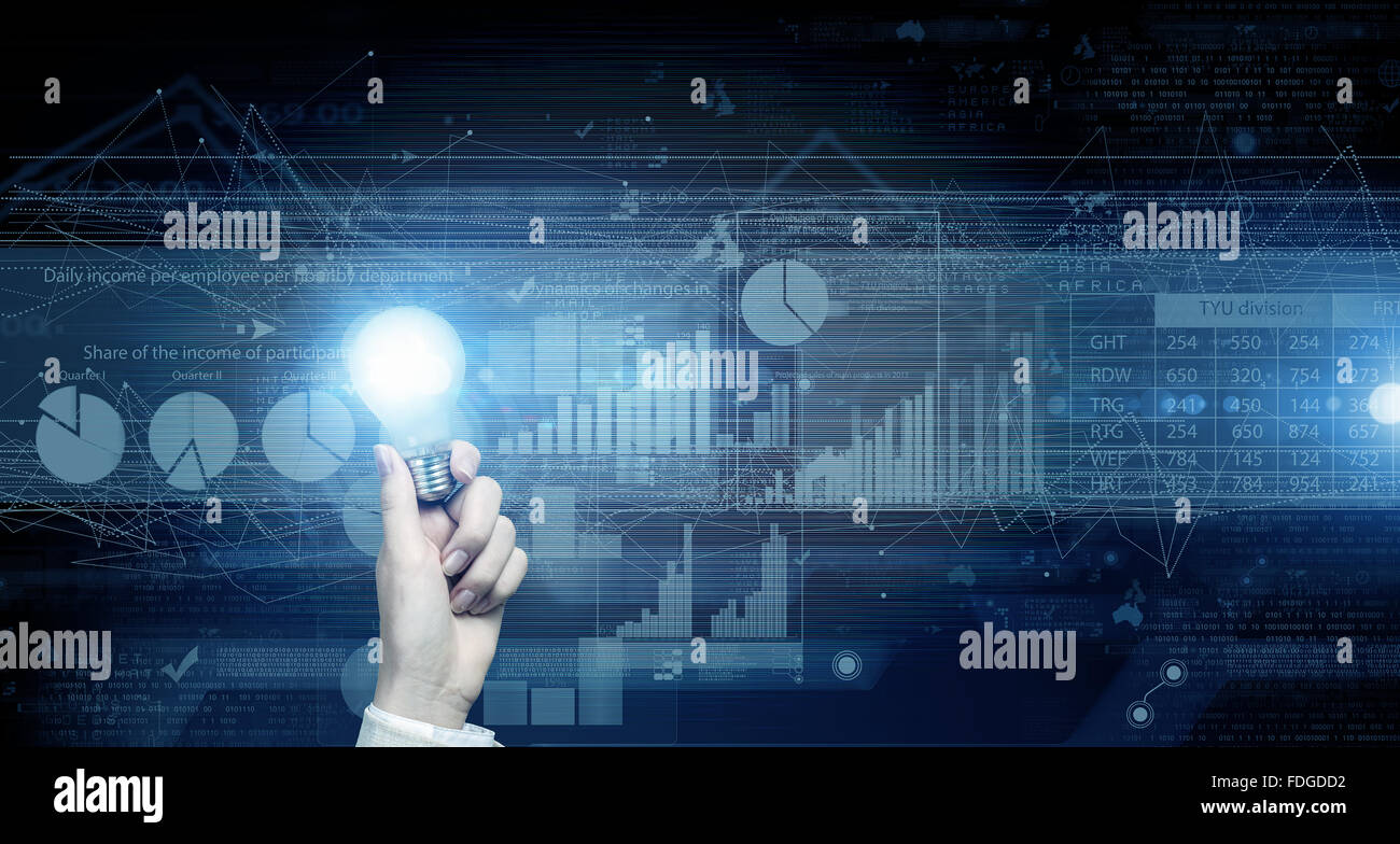 Human hand holding a shining electric bulb on digital background Stock ...