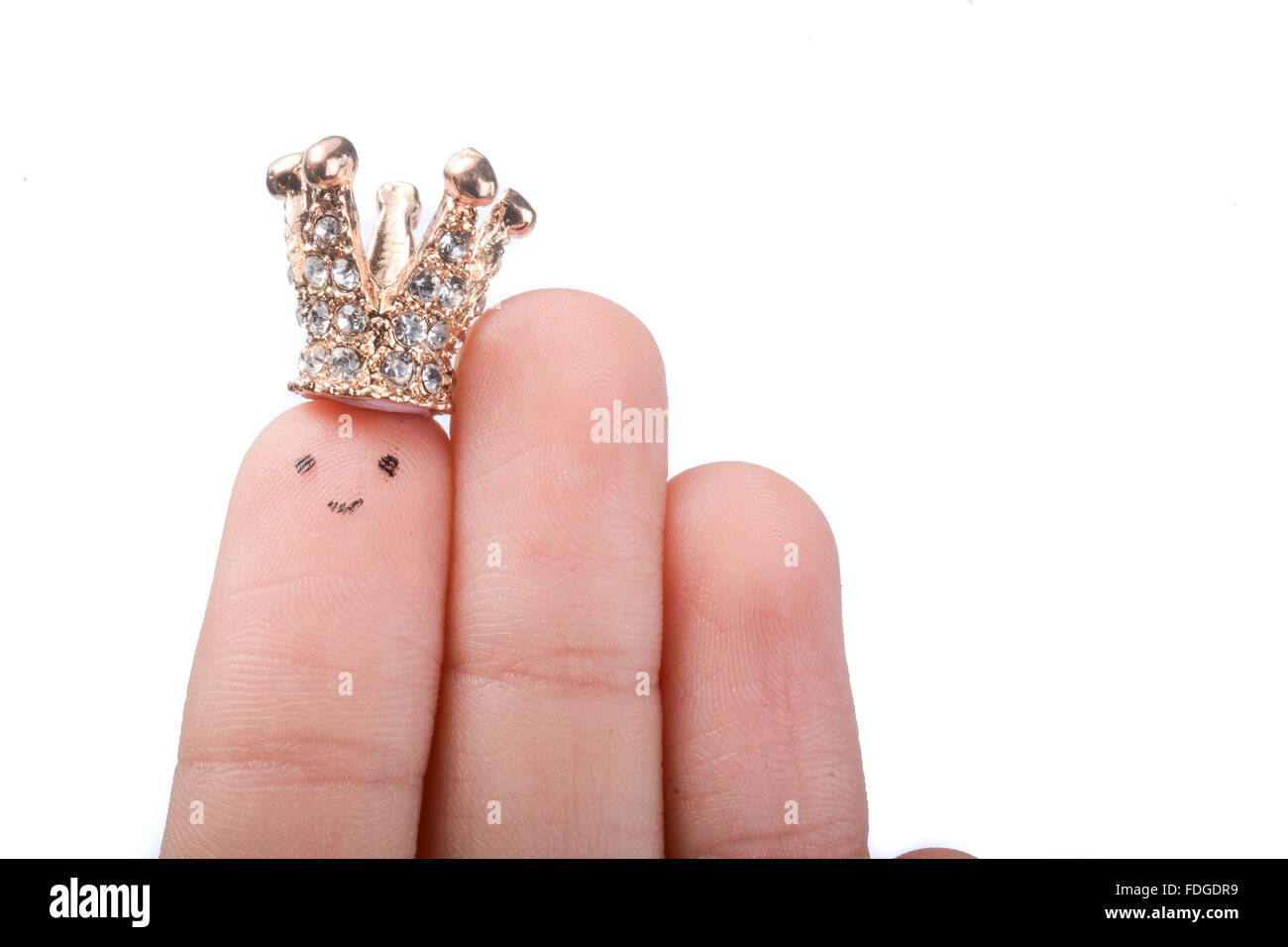 Finger with dots like a face and a crown on the top Stock Photo - Alamy